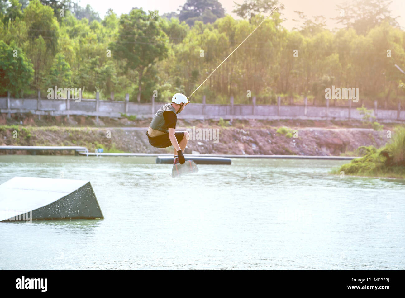 wakeboarding at the wake park. Outdoor and extreme sport Stock Photo ...