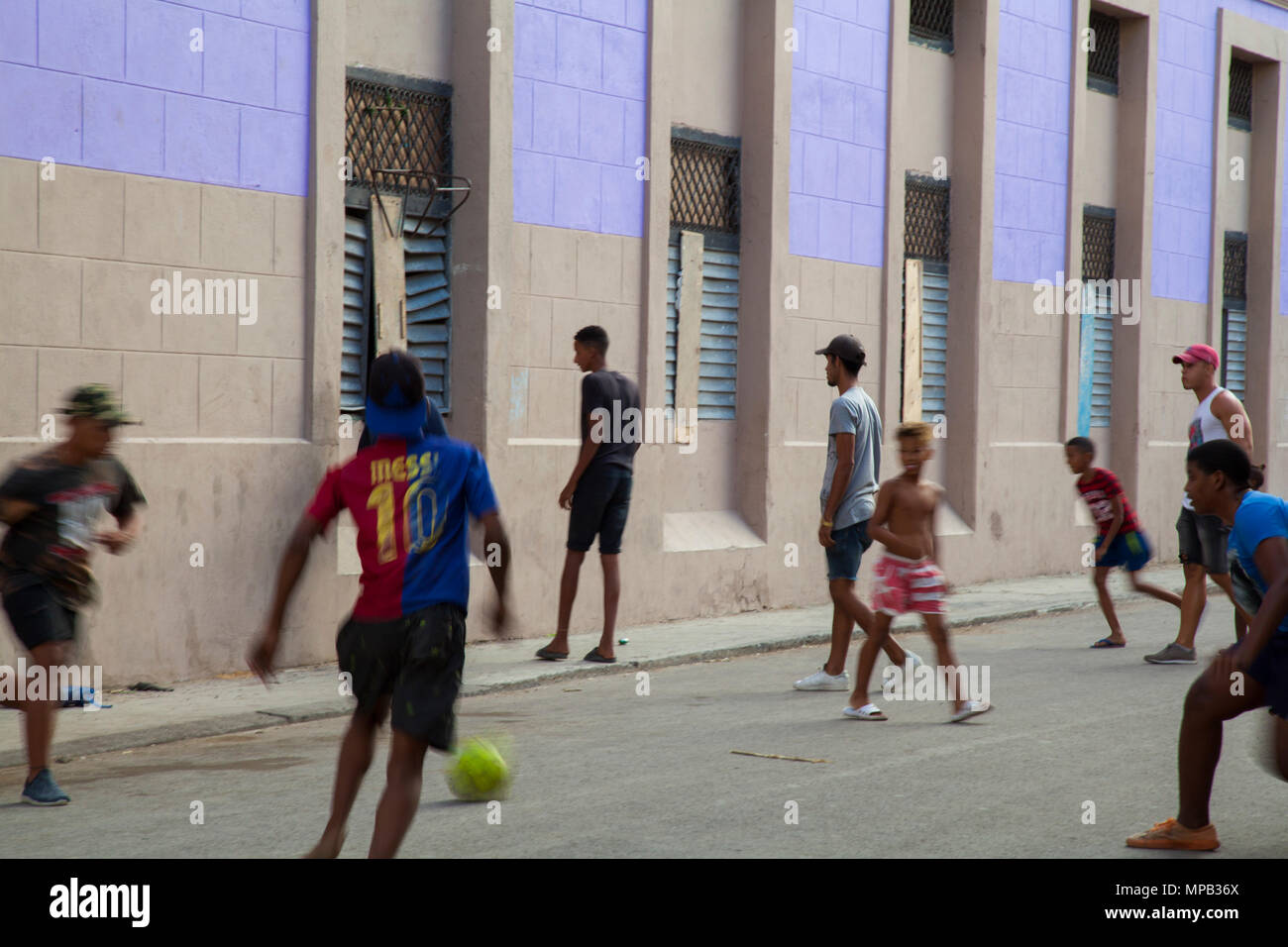 Local cuban children playing soccer and basketball in the streets of ...