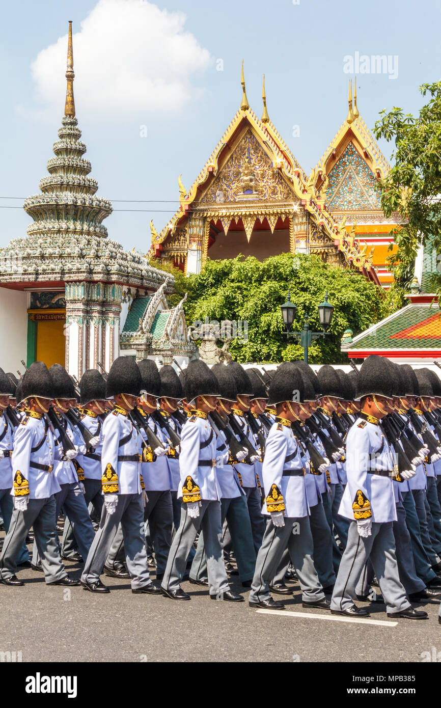 Thai soldiers in white uniforms on parade outside the Grand Palace ...