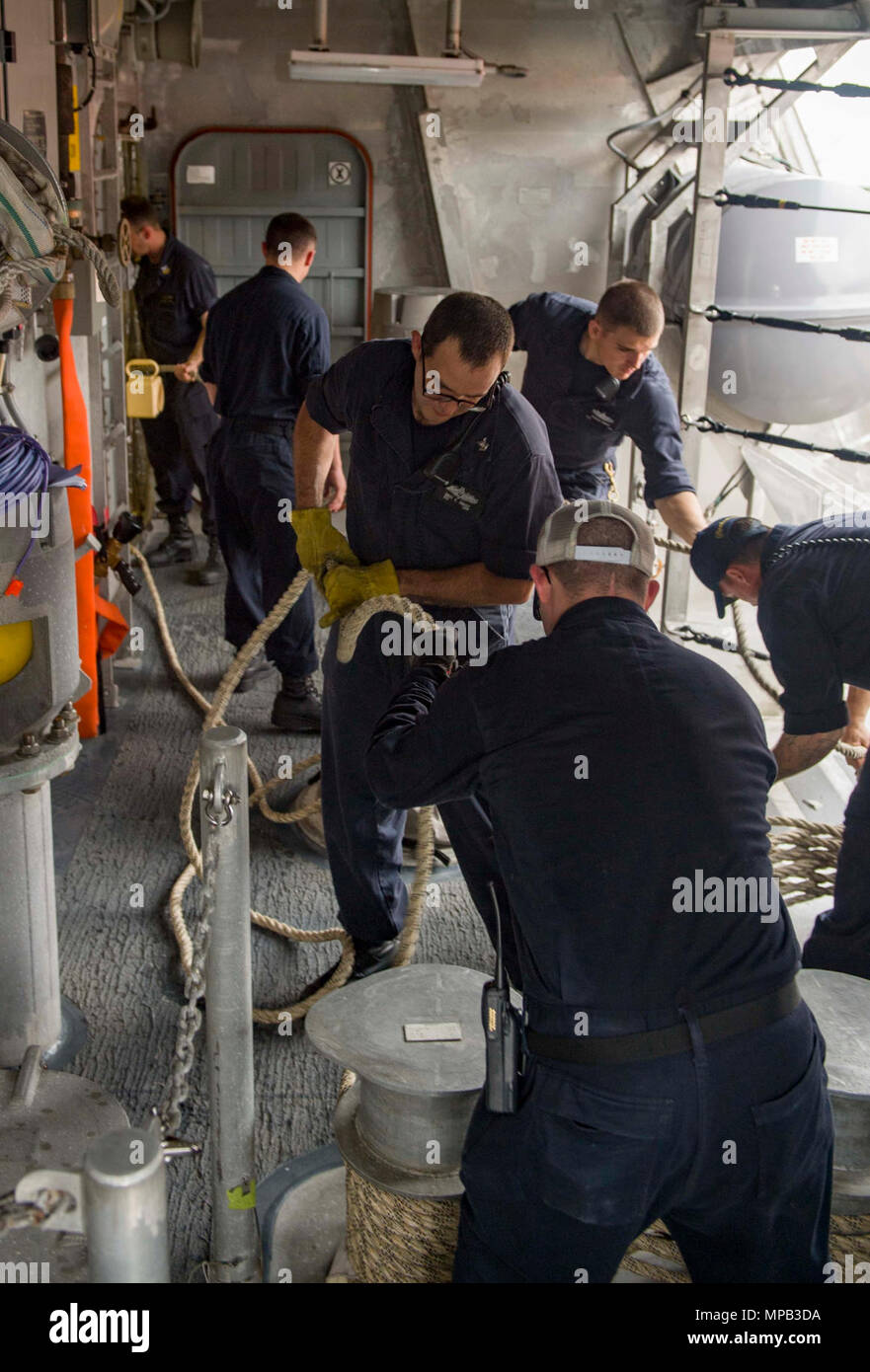 170408-N-WV703-033 SOUTH CHINA SEA (April 8, 2017) Sailors take in all ...