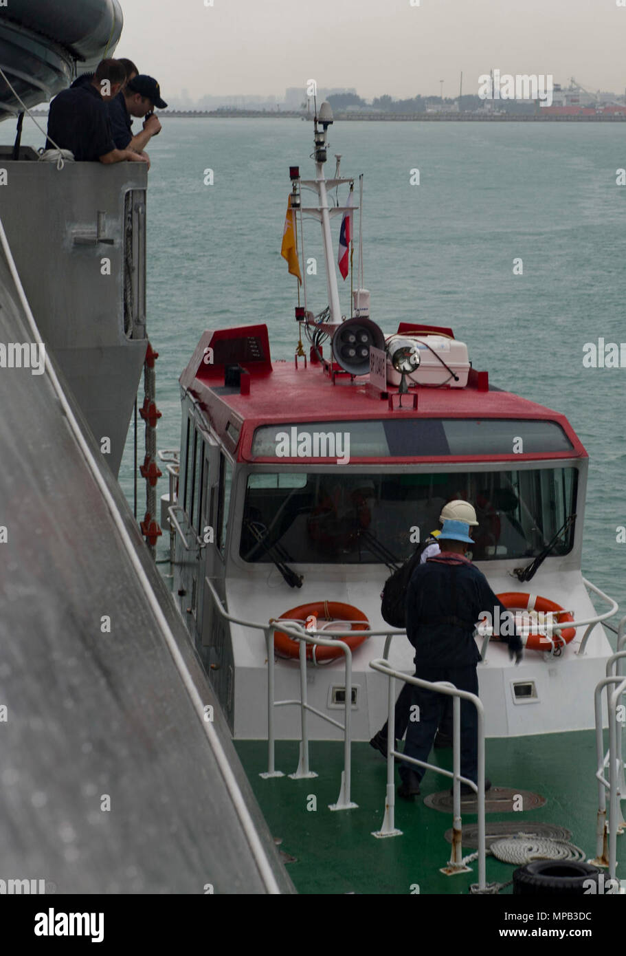 170408-N-WV703-084 SOUTH CHINA SEA (April 8, 2017) Sailors assist a ...