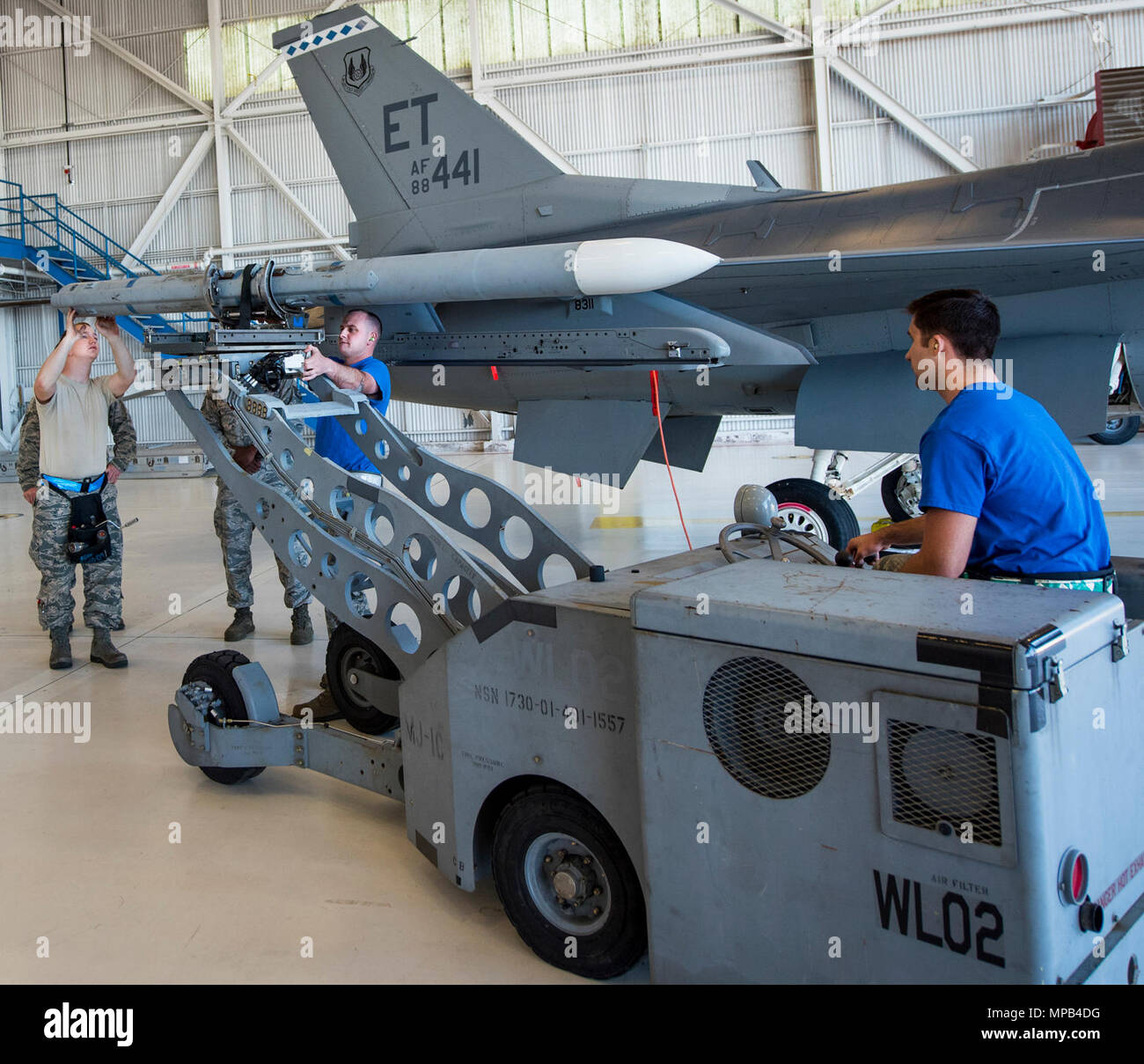 The 96th Aircraft Maintenance Squadron Blue team loads an AIM-120 ...