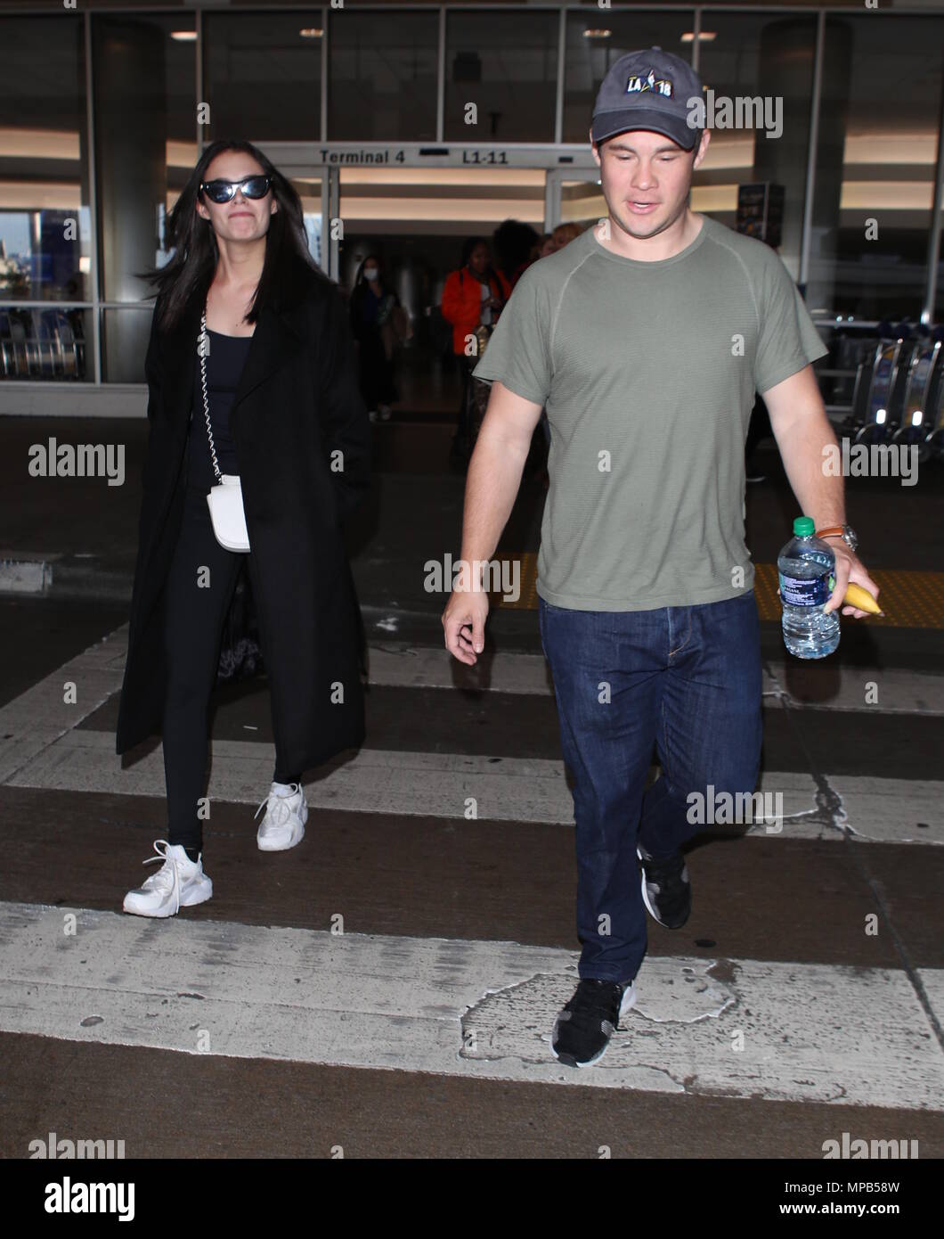 Adam DeVine and girlfriend Chloe Bridges arrive at Los Angeles ...