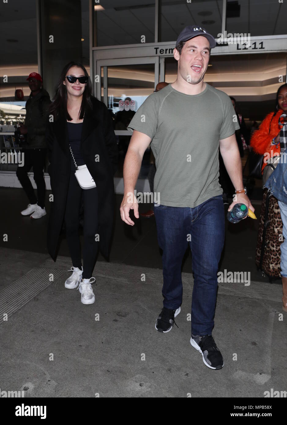 Adam DeVine and girlfriend Chloe Bridges arrive at Los Angeles ...