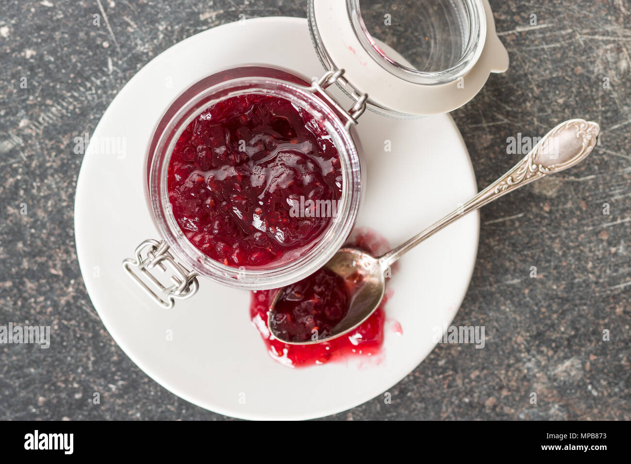 Raspberry jam jelly in jar. Top view Stock Photo - Alamy