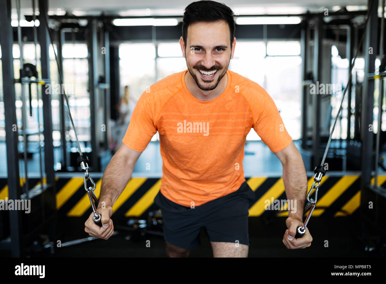 Man working out in gym Stock Photo - Alamy