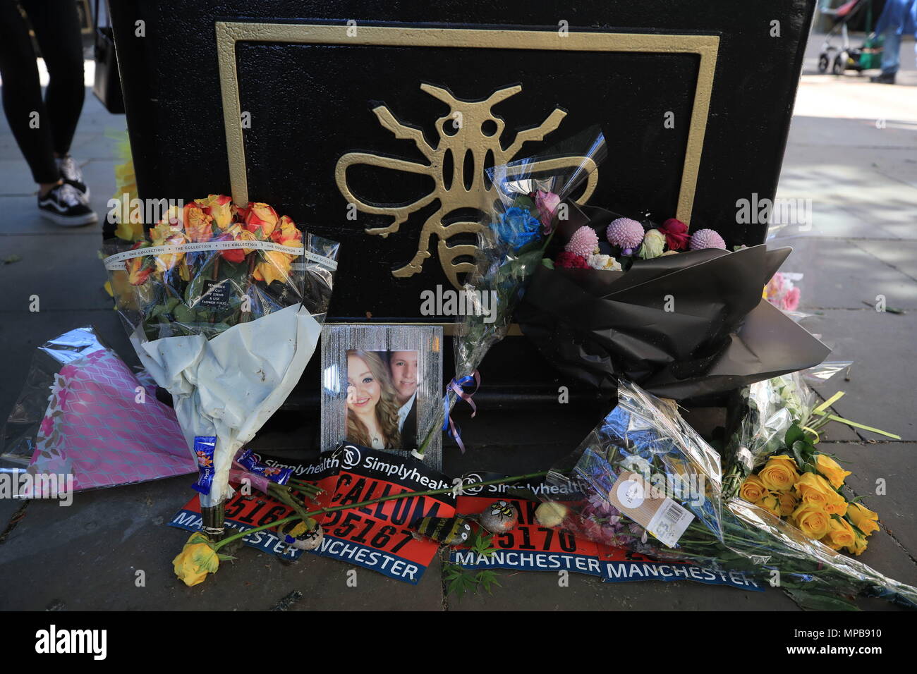 Flowers and a picture of Chloe Rutherford and Liam Curry, who were ...