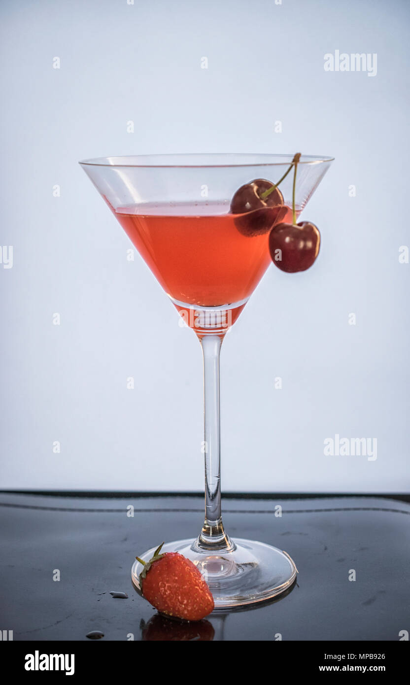 Red Cocktail in a Martini Glass Stock Photo - Alamy