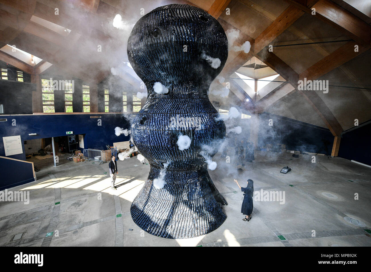 Smoke rings bellow from a new sculpture by Studio Swine as it is ...