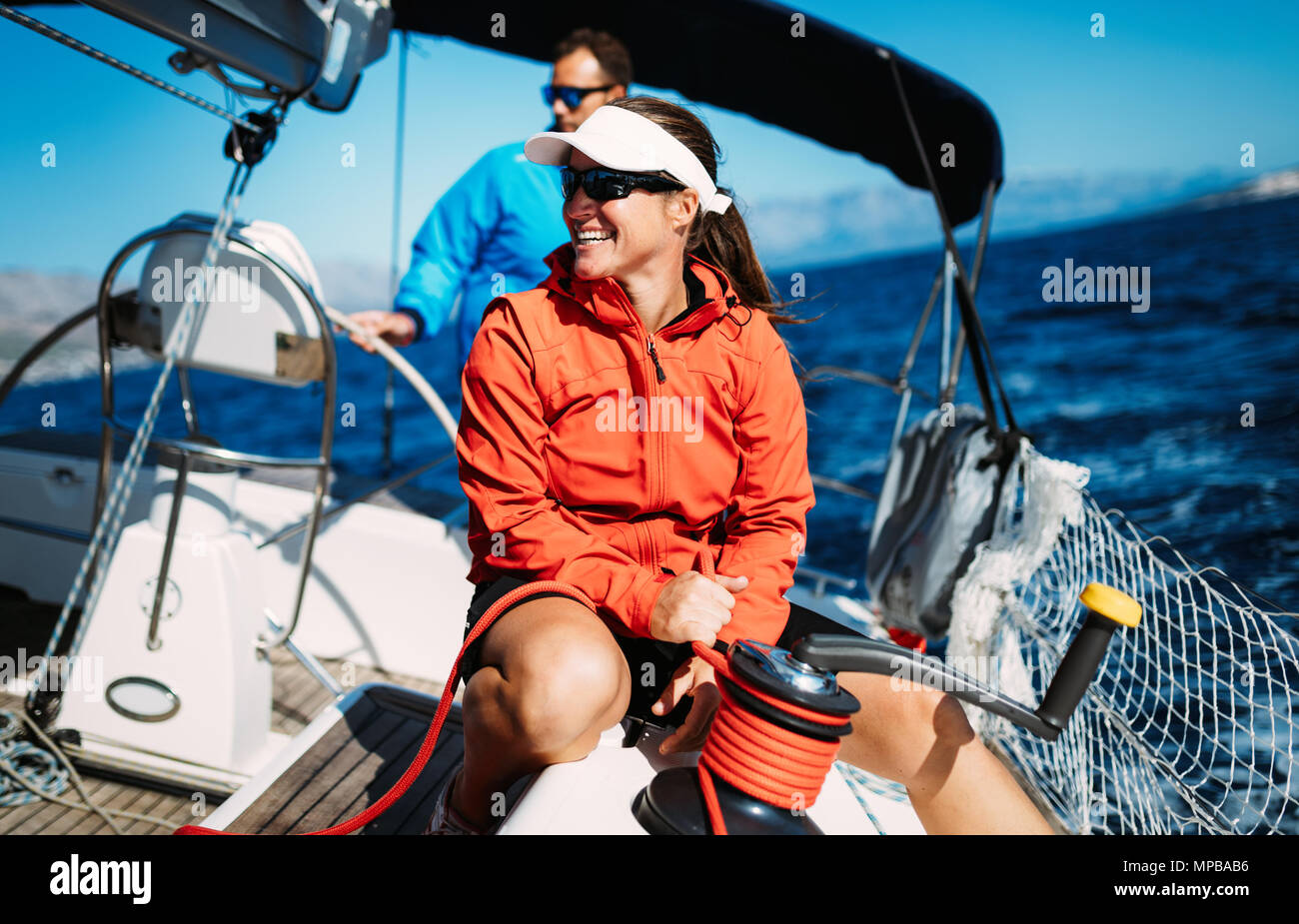 Attractive strong woman sailing with her boat Stock Photo - Alamy
