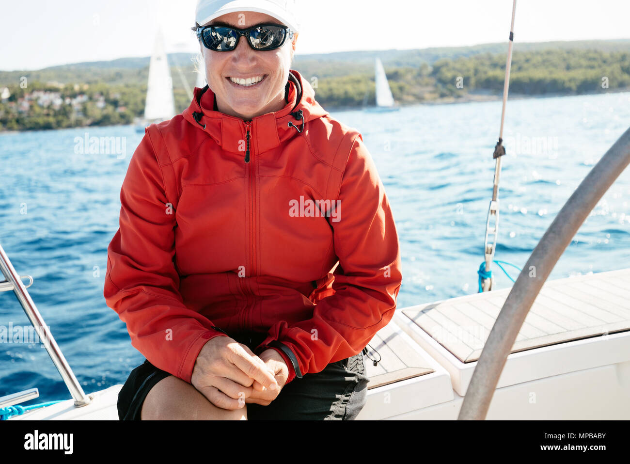 Attractive strong woman sailing with her boat Stock Photo - Alamy