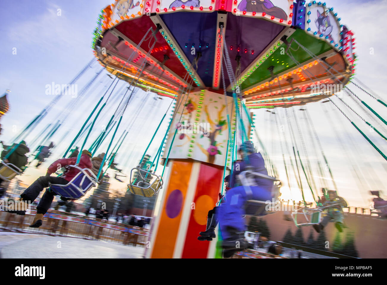 Abstract motion blur carousel spinning with kids, long exposure Stock ...