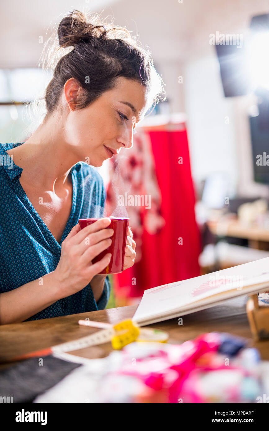 Fashion designer working on a new model, in her studio Stock Photo - Alamy