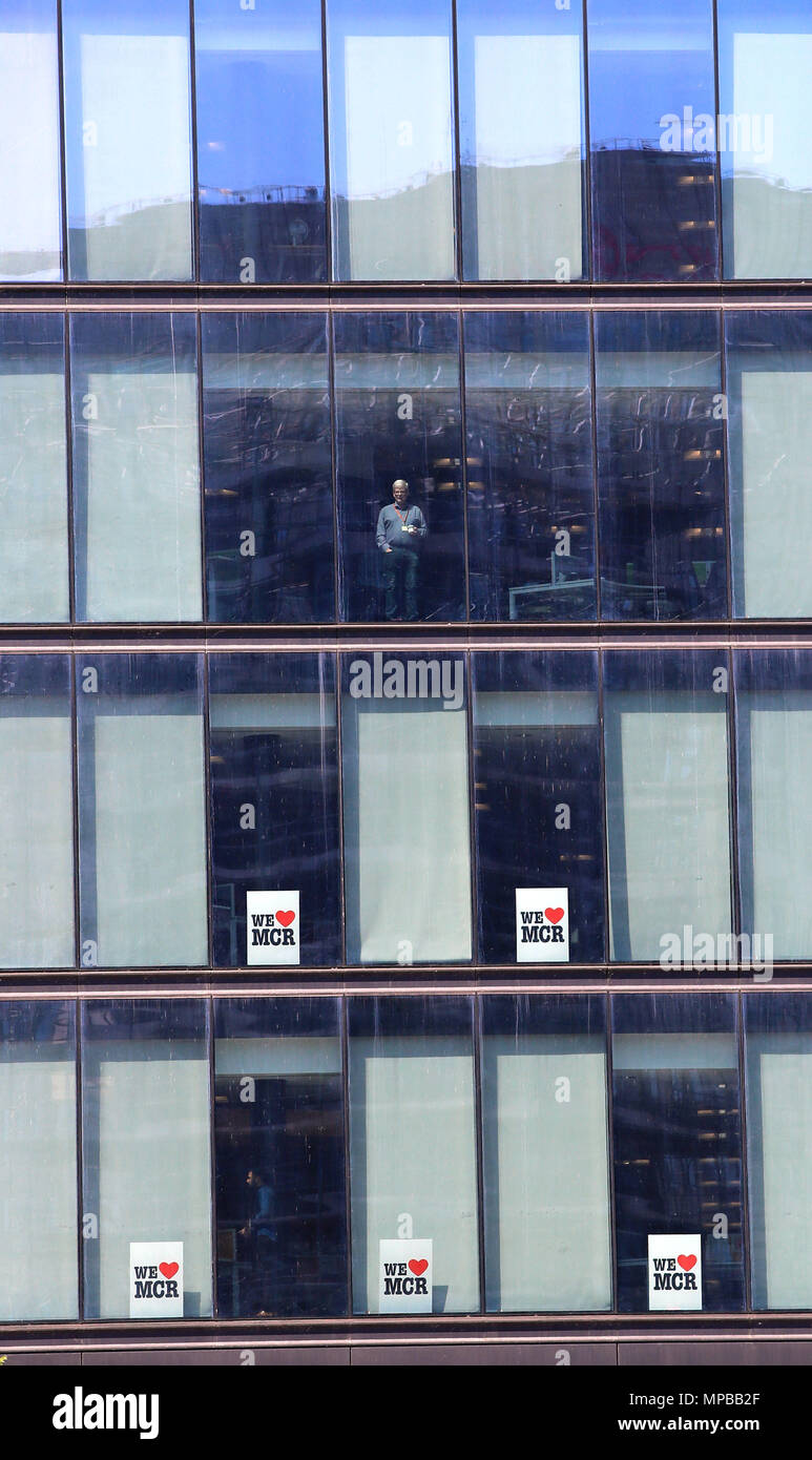 People watch on from the Swinton Group building, with 'I Love ...