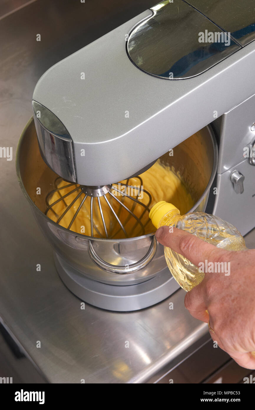 preparation of the mayonnaise egg with a kitchen robot, in the kitchen ...