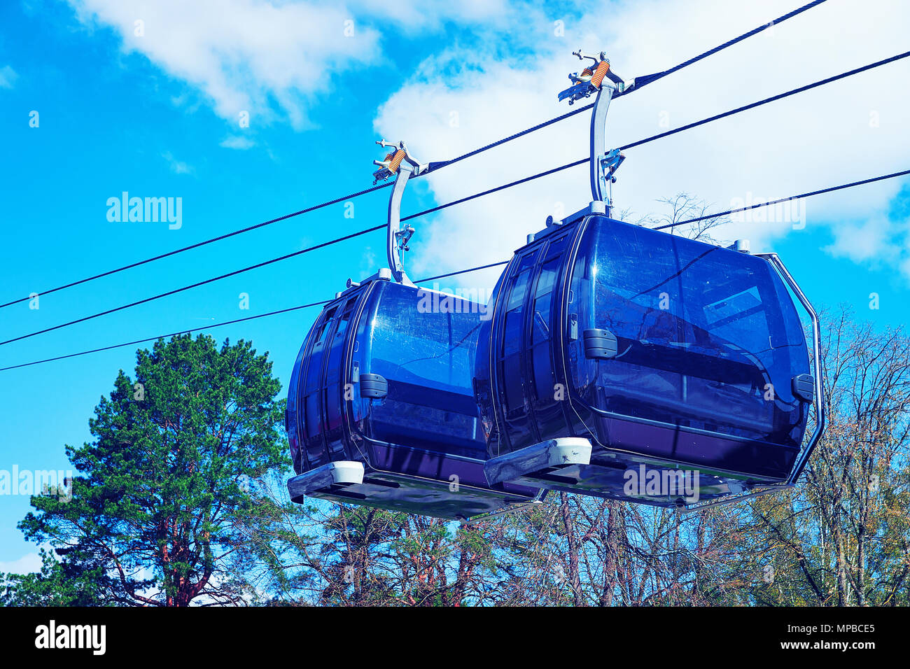 Cable cars moving at the ropeway. Toned Stock Photo - Alamy