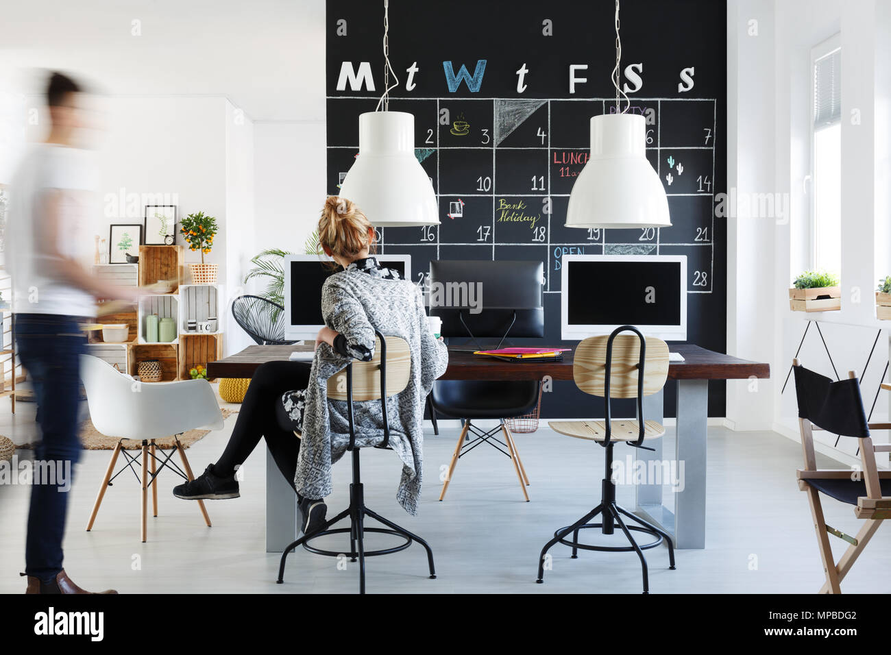 Simple style office with wood desk, chairs and computers Stock Photo ...