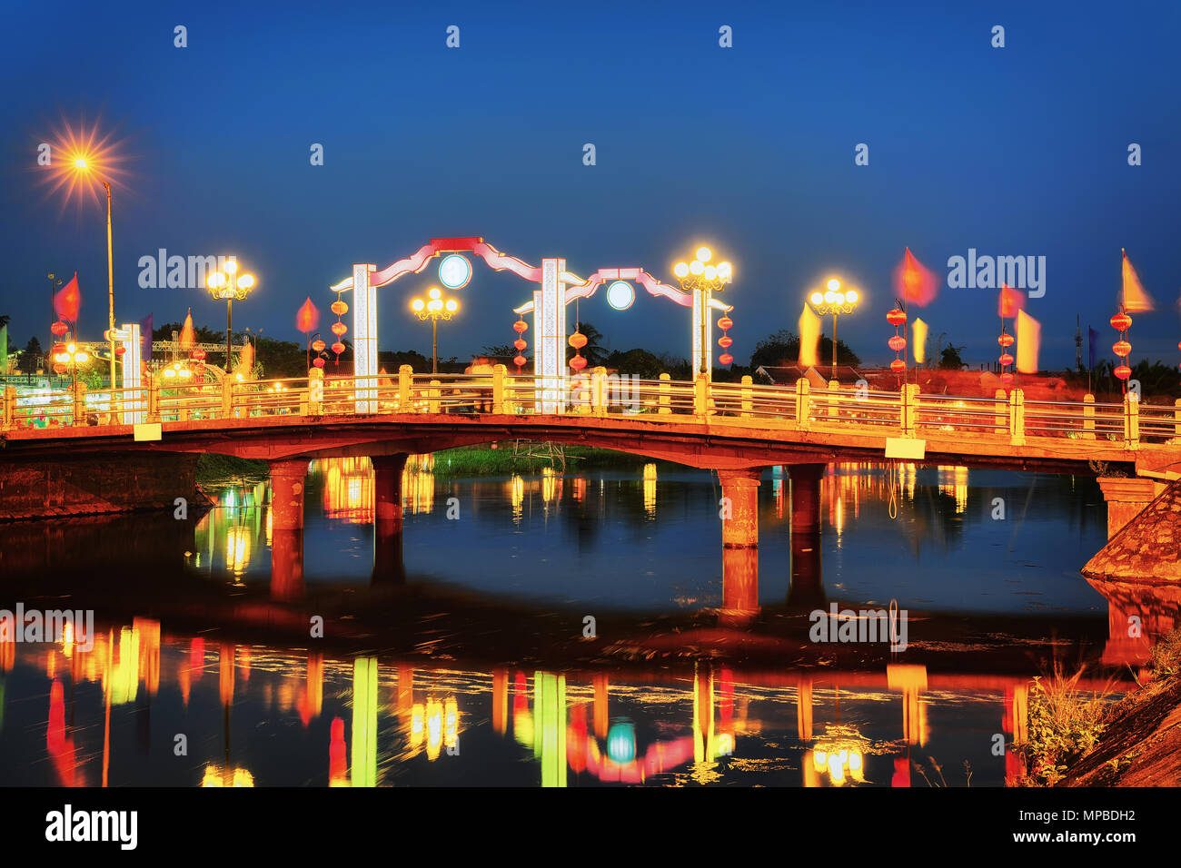 Bridge in Thu Bon River in Hoi An, Vietnam. Late in the evening Stock ...