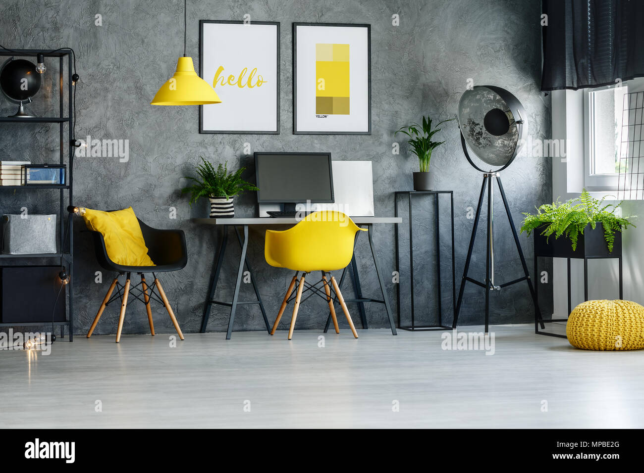 Modern yellow and grey apartment studio with workspace with computer ...