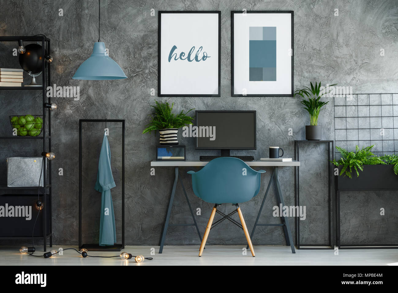 Stylish turquoise and gray interior with desk and mock-up posters Stock ...