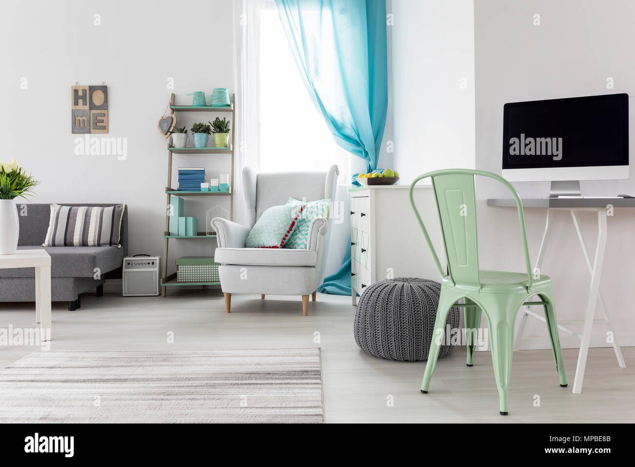 Spacious bright room with cosy space to work Stock Photo - Alamy