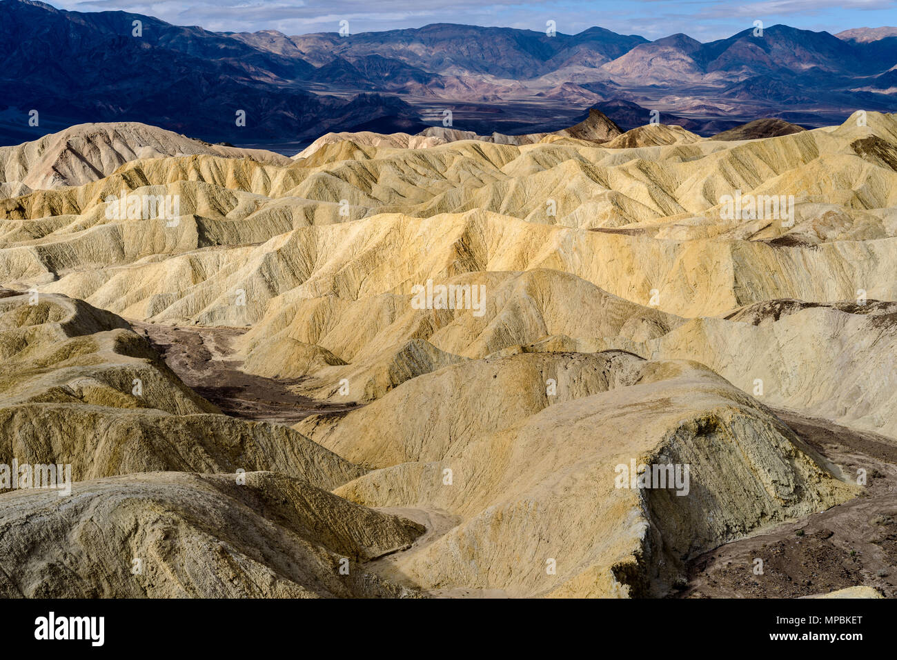 Golden Canyon - A cloudy-day overview of rolling mud stone hills ...