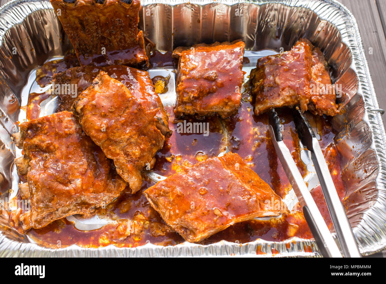 Marinated pork back ribs ready to be grilled on barbecue Stock Photo ...
