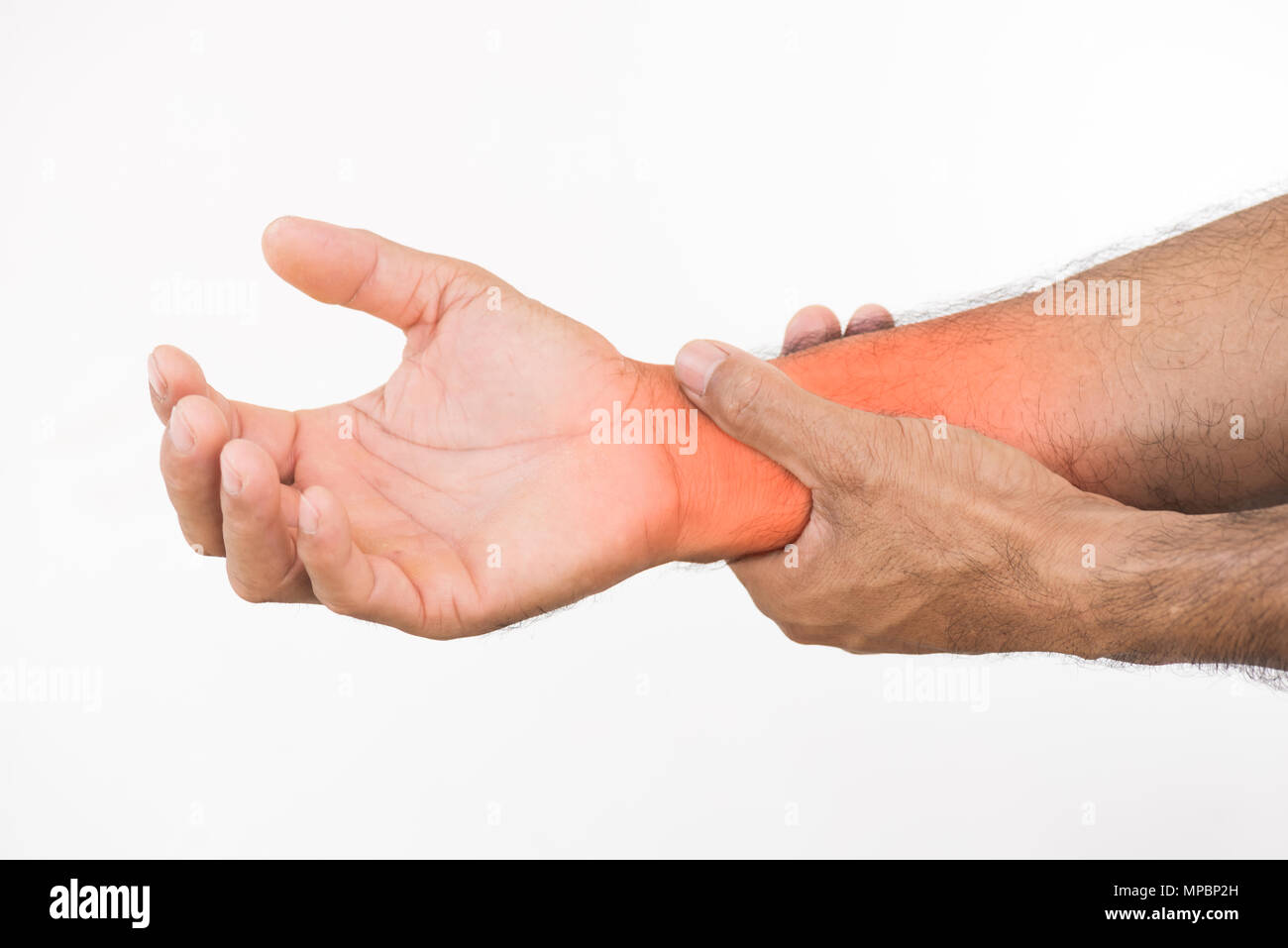 Closeup unhappy man suffering from wrist, arm pain and injury on white ...