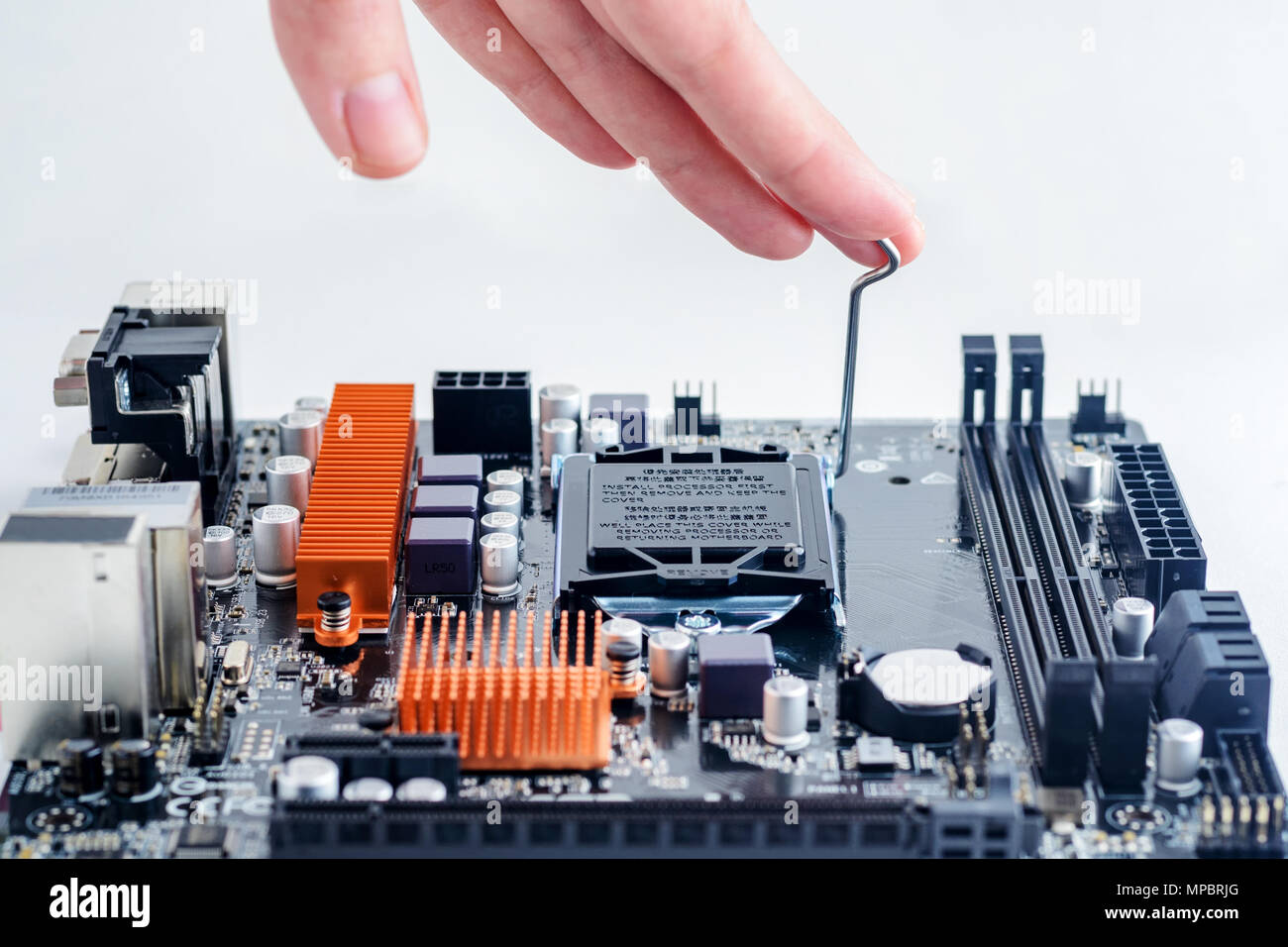 Installing the processor in the computer's motherboard. Computer ...