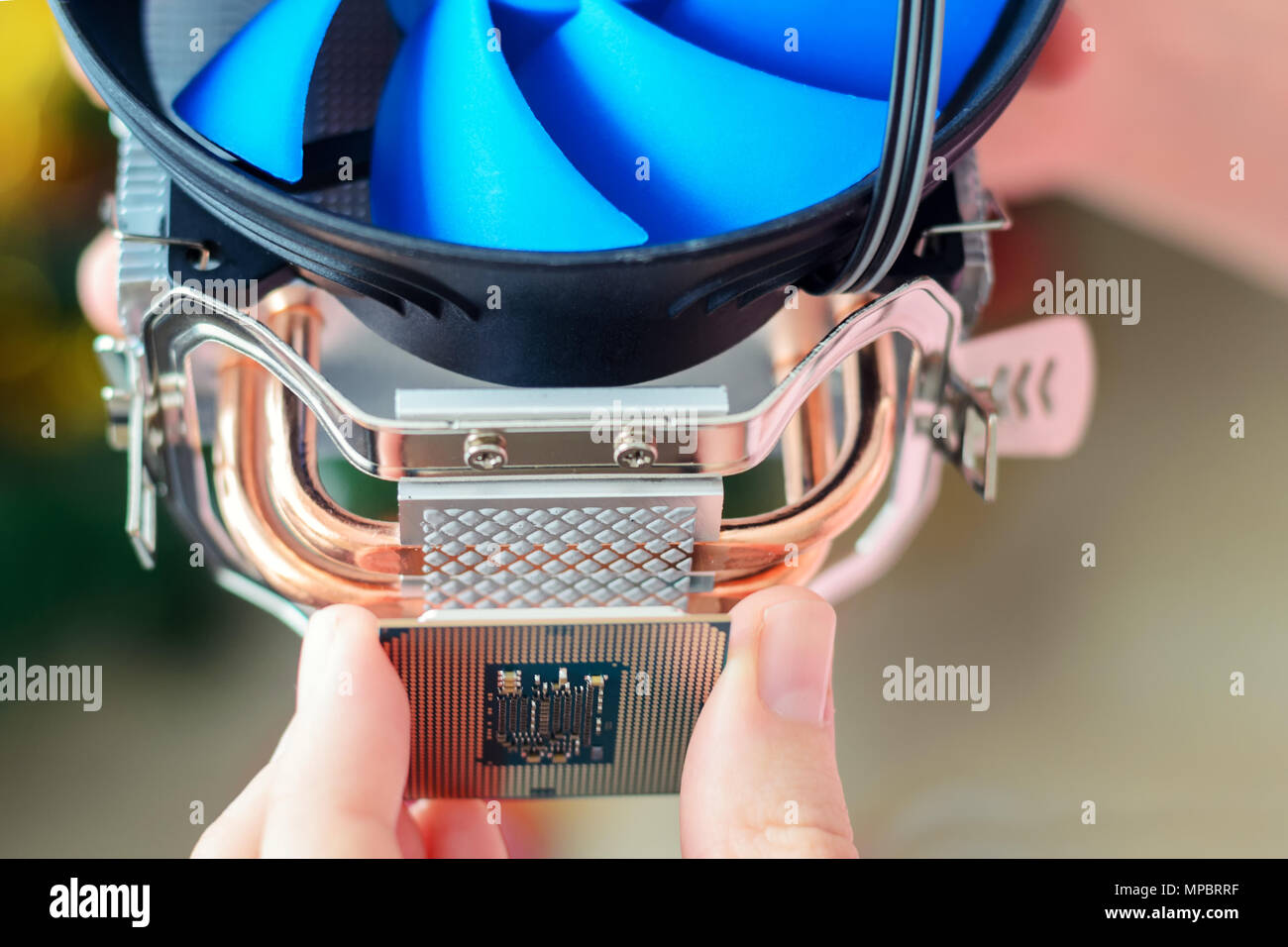 installation of the cooler with the applied thermal paste on the ...