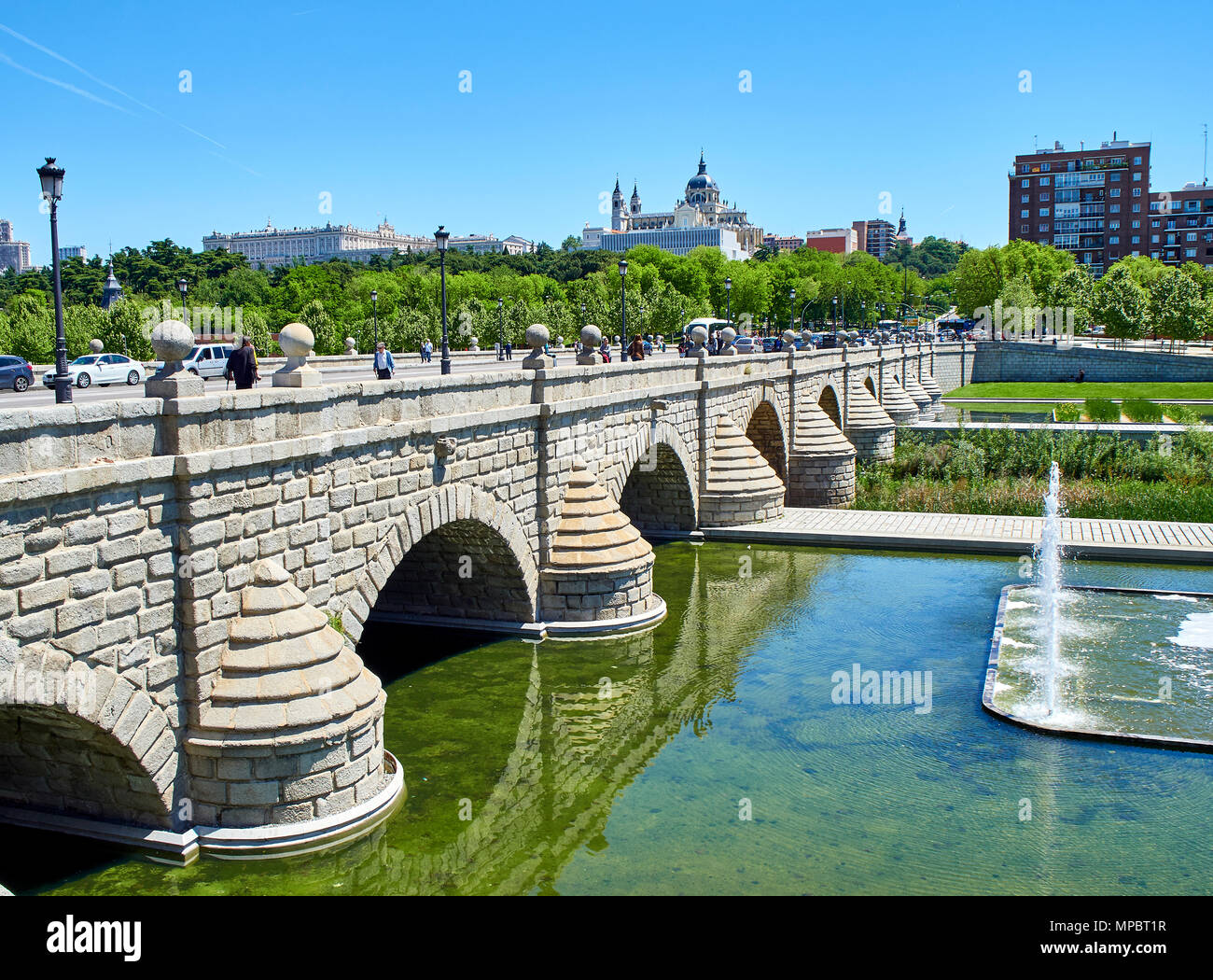 Puente de Segovia bridge crossing the gardens of Madrid Rio at spring ...
