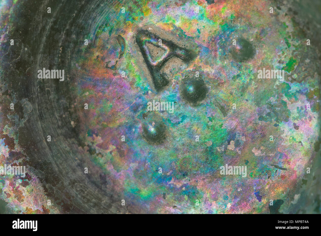 Iridescence on ancient old weathered glass, weathering on the surface ...