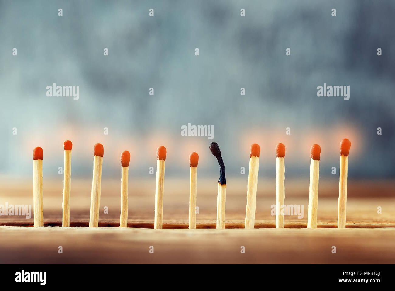 Burnt matchsticks in black background hi-res stock photography and ...