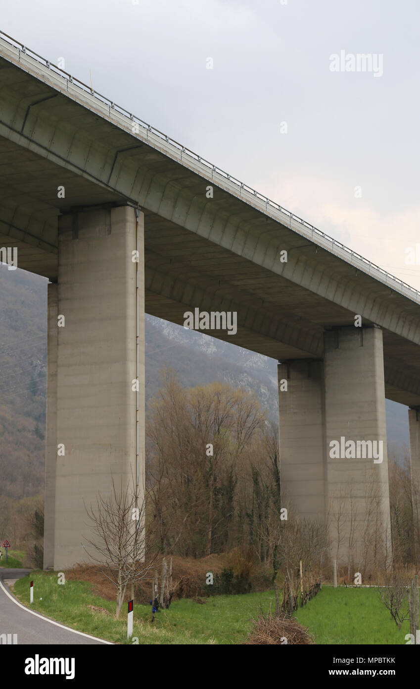 concrete highway viaduct passing over a mountain valley Stock Photo - Alamy