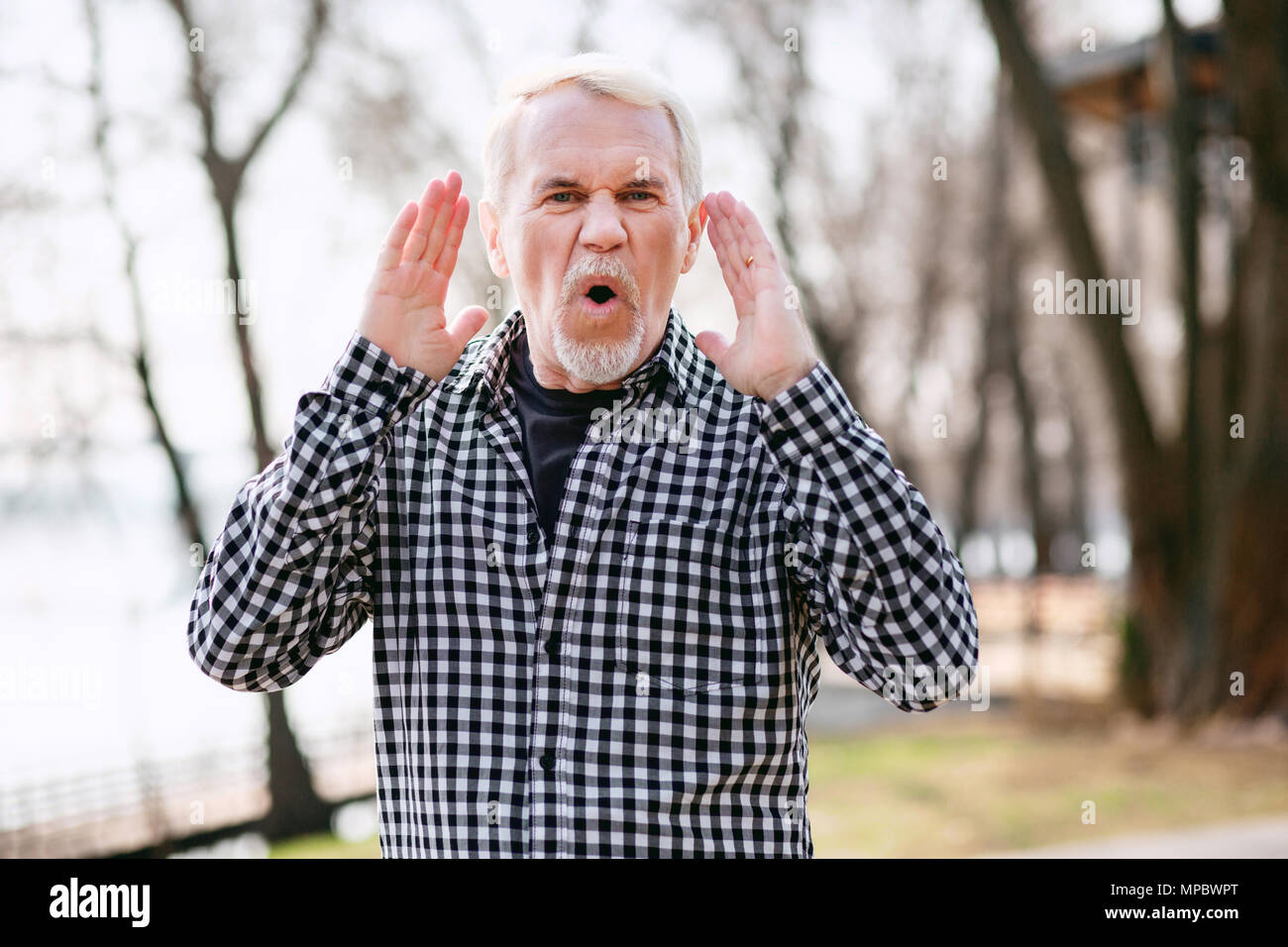 Mad senior man screaming Stock Photo - Alamy