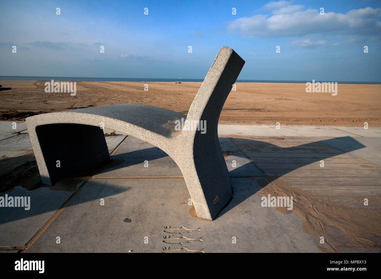 Concrete chair on the beach of scheveningen Stock Photo - Alamy
