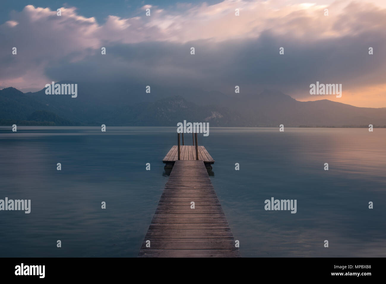 Wooden bridge with mountain background Stock Photo - Alamy