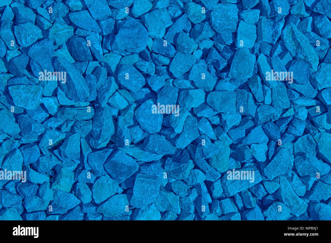 Ultra blue Pebble textured surface, stone backdrop and boulder ...