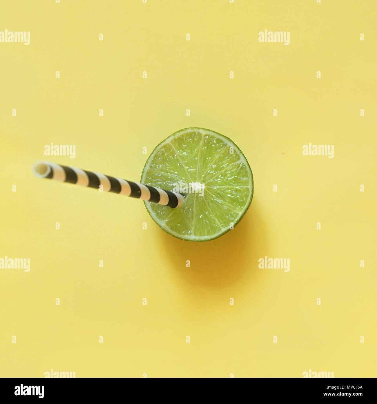 Concept heat minimal summer. Sliced lime with straw as concept fresh ...