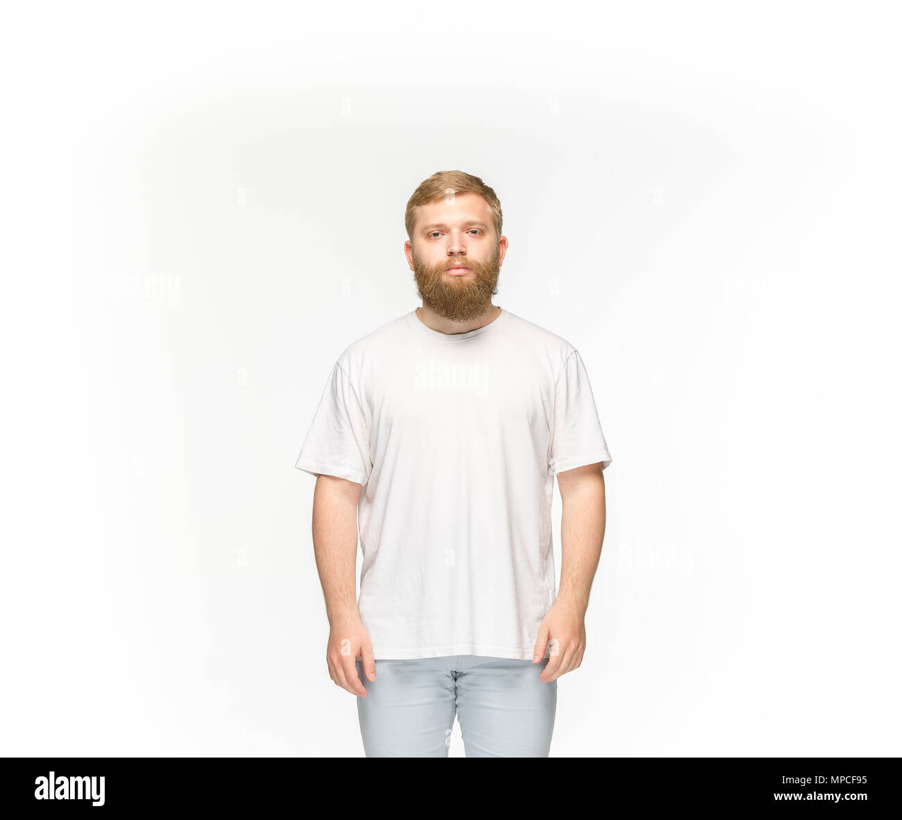 Closeup of young man's body in empty white t-shirt isolated on white ...
