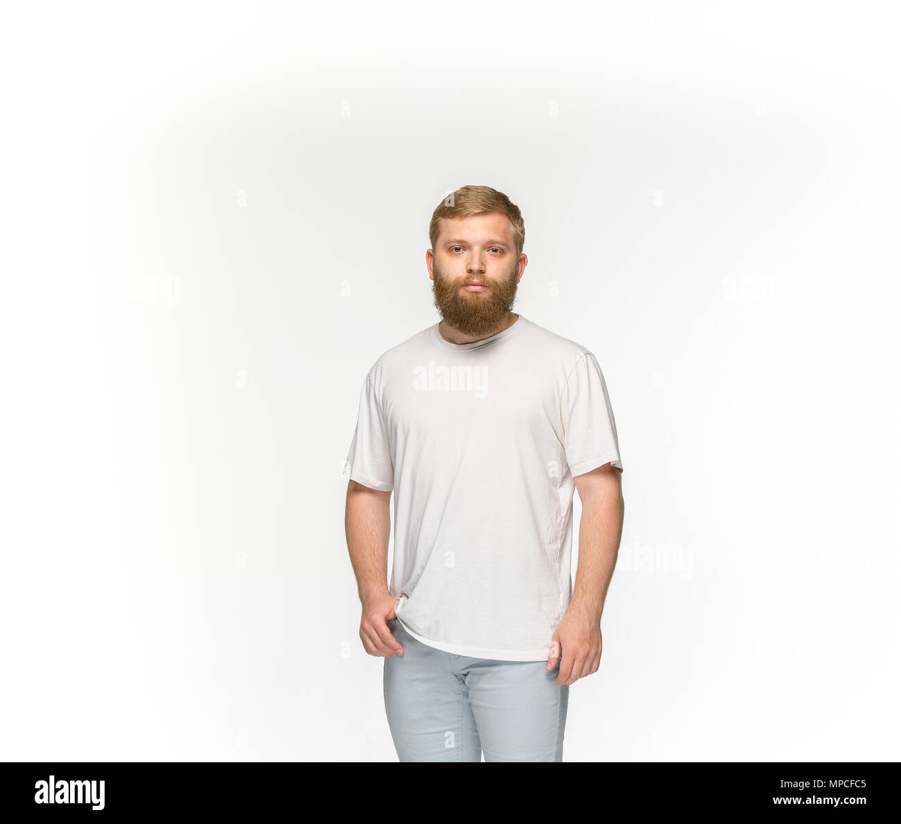 Closeup of young man's body in empty white t-shirt isolated on white ...