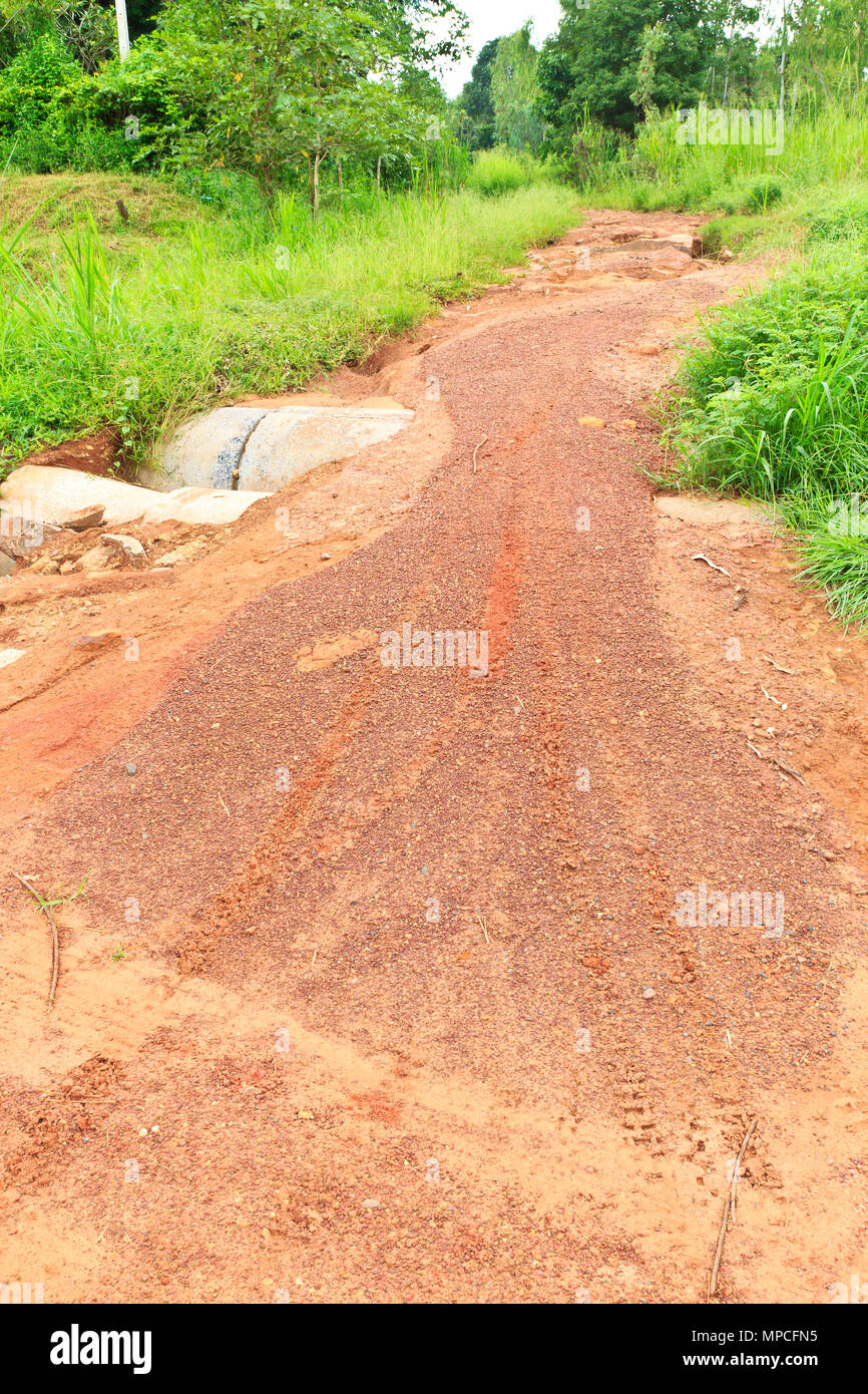 Dilapidated road in asia country Stock Photo - Alamy