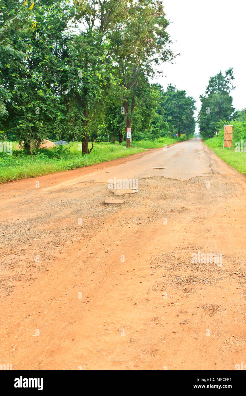 Dilapidated asphalt road in asia country Stock Photo - Alamy