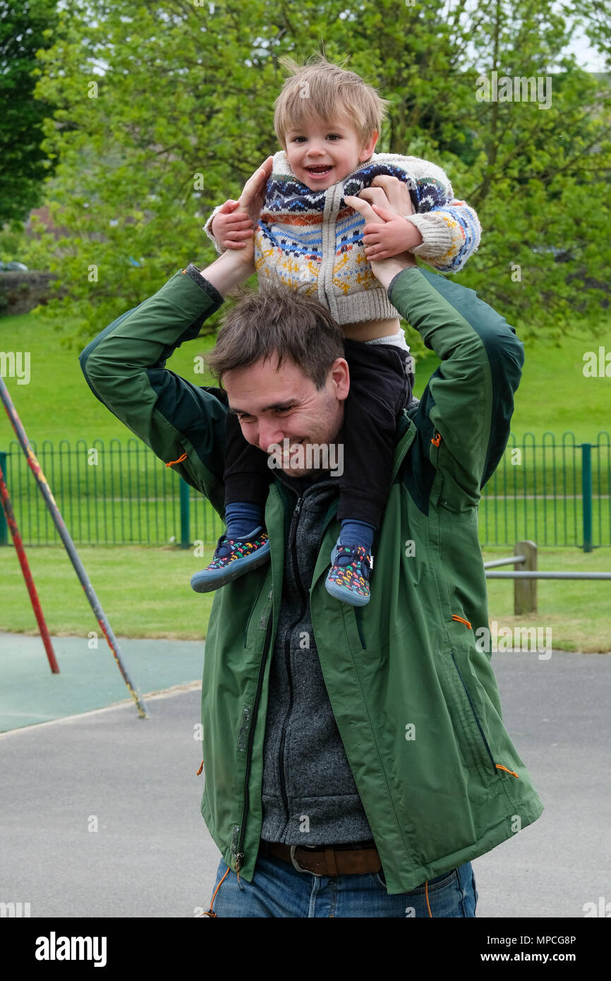 Child being carried on shoulders hi-res stock photography and images ...