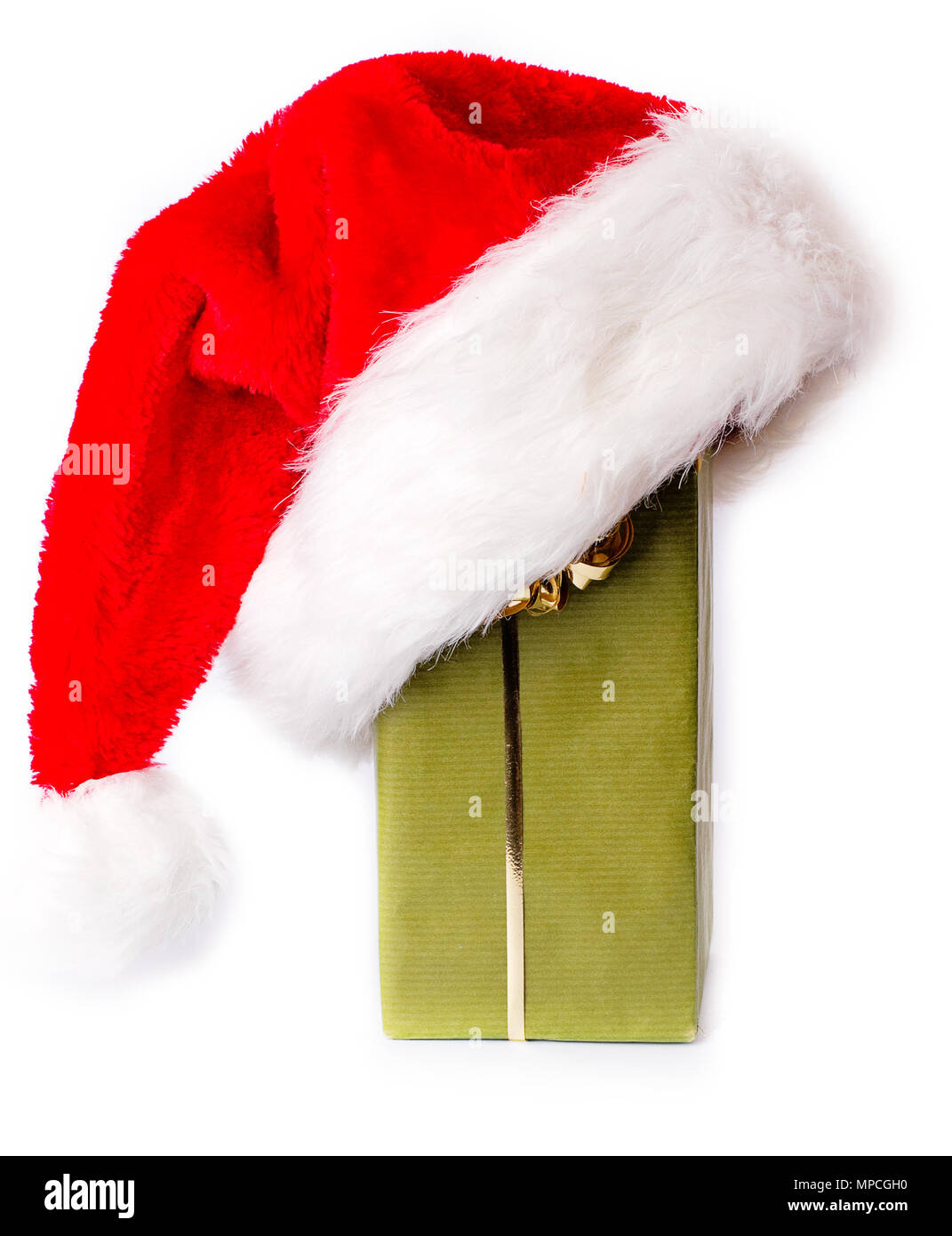 Santa hat is put on a gift box Stock Photo - Alamy