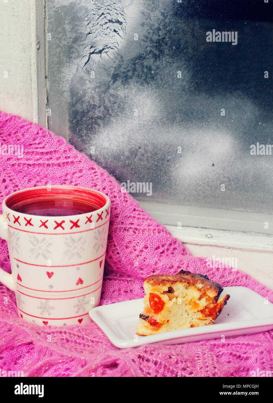 cup of tea on a windowsill near the winter window Stock Photo - Alamy