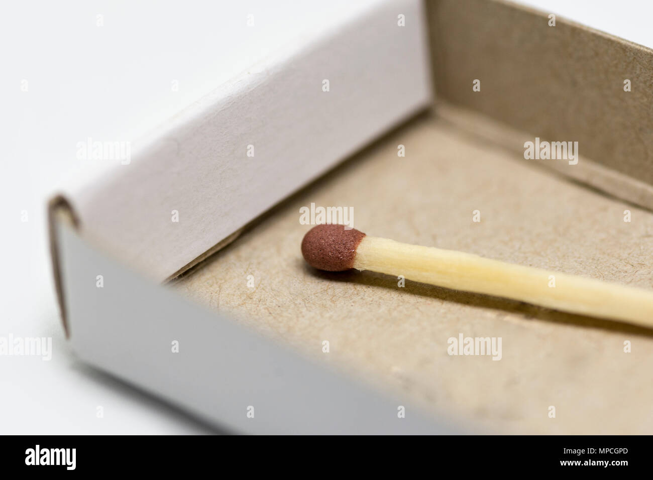 one single matchstck inside the box Stock Photo - Alamy