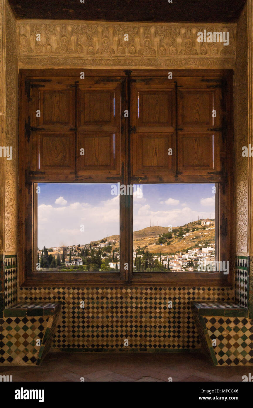 View from a window of the Alhambra in Granada in Spain with benches ...
