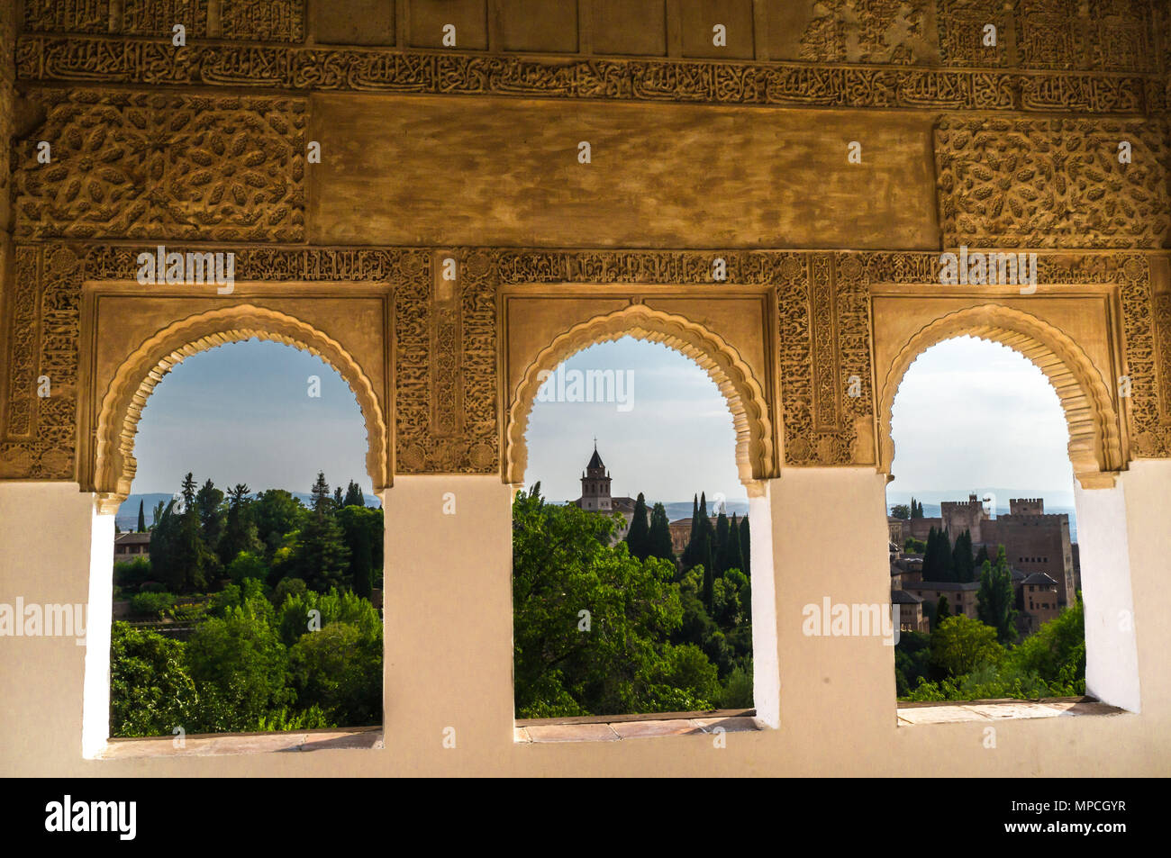 Three windows and muslim stucco in the Alhambra of Granada in Spain ...