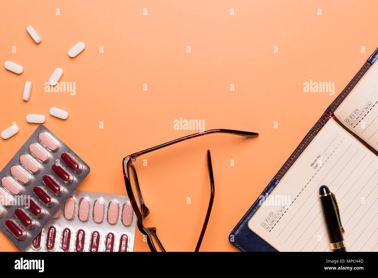 healthcare and medical concept medicine on the orange background with ...